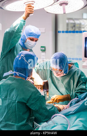 Arm fracture surgery. Surgeon operating on a patient during surgery to ...