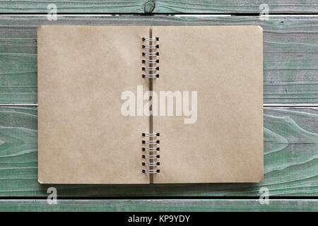 blank spiral notebook on grunge wood background Stock Photo - Alamy
