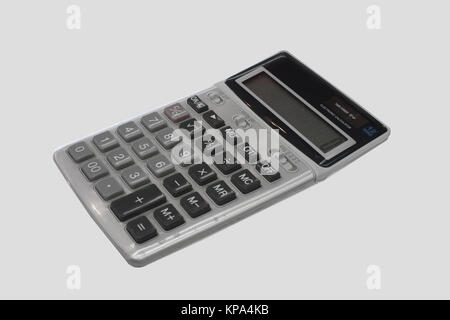 grey plastic office calculator on a blue surface Stock Photo - Alamy