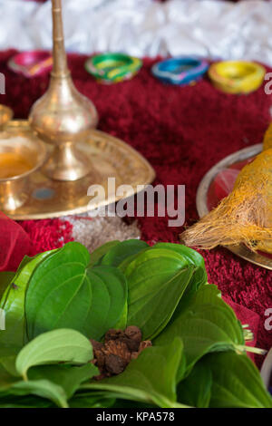 Traditional Indian Hindu religious praying items in ear piercing ...