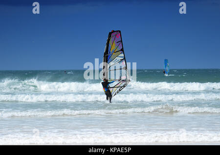 Men windsurfing waves in Gwithian, Cornwall, UK Stock Photo - Alamy