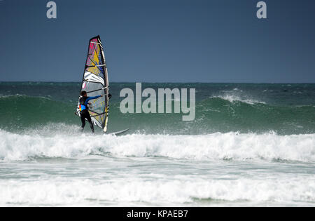 Man windsurfing waves in Gwithian, Cornwall, UK Stock Photo - Alamy