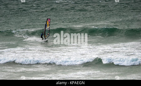 Man windsurfing waves in Gwithian, Cornwall, UK Stock Photo - Alamy
