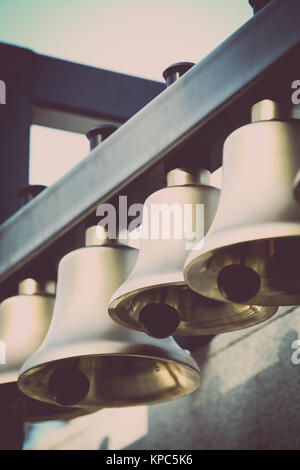 Various bells in a row Stock Photo - Alamy