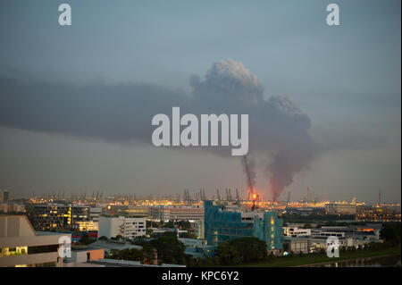 Explosion of a shell in the sky and burning debris flying with smoke ...