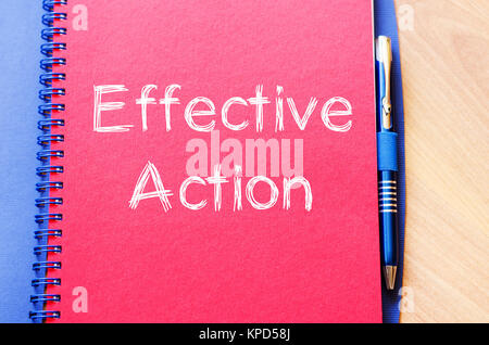 Effective action write on notebook Stock Photo - Alamy