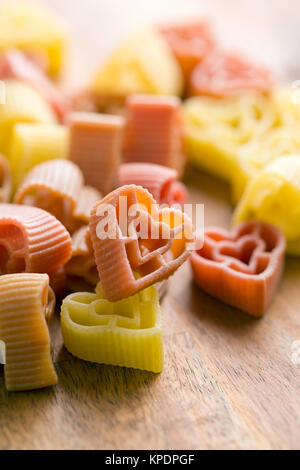 Colorful heart shaped macaroni pasta flat lay isolated Stock Photo - Alamy