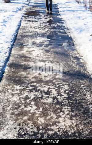 slippy footpath in urban park in sunny winter day Stock Photo - Alamy