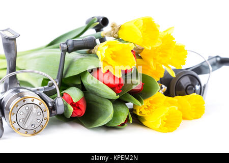 fishing tackles with spring flowers narcissus and tulips on white ...