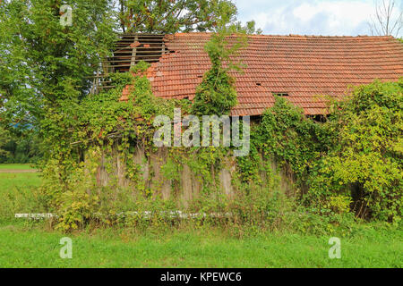 Old wooden bar with red roof and old bricks Stock Photo - Alamy