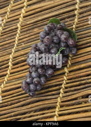 Fresh grape on wicker mat isolated on white Stock Photo - Alamy