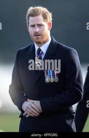 Prince Harry insects the graduating officer cadets at the Royal ...