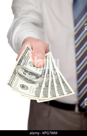 Businessman reaching out to dollars Stock Photo - Alamy