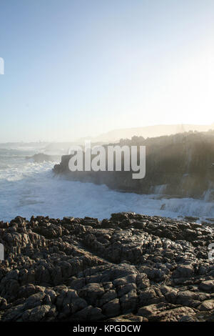 South Africa, Hermanus, Waves crashing on rock formation on beach Stock ...
