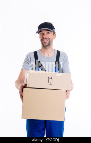 friendly postman with parcels in front of white background Stock Photo ...