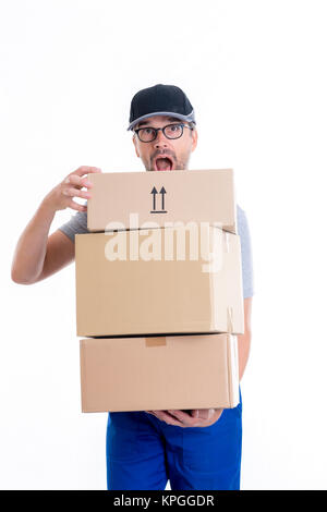 overstrained postman with parcels in front of white background Stock ...