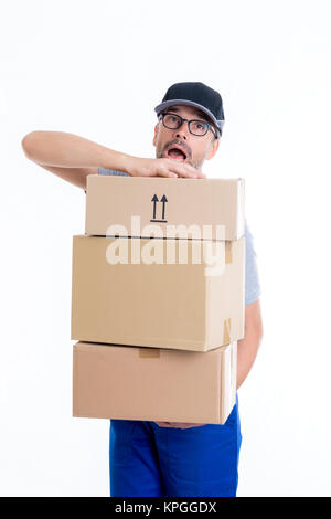overstrained postman with parcels in front of white background Stock ...