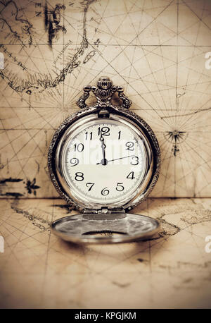 Vintage watch on antique map. Retro still life Stock Photo - Alamy