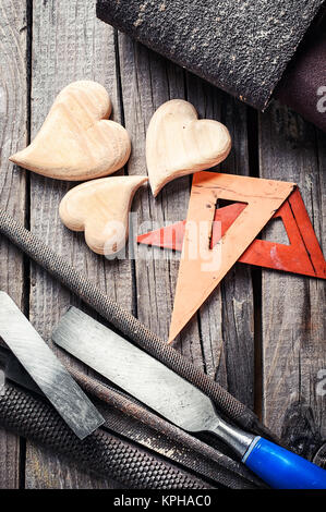 Symbolic wooden hearts cut by hand and carpenter tools Stock Photo - Alamy