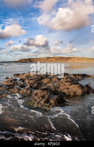 View across sandy beach to Holyhead ferry Port from Penrhos Country ...