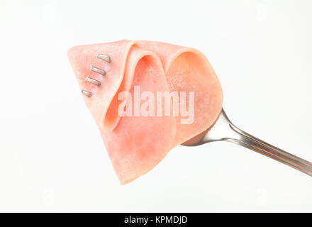 Thin slices of ham on fork Stock Photo - Alamy