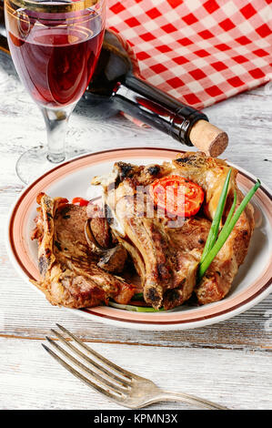 Juicy thick grilled T-bone beef steak seasoned with rosemary fresh of ...