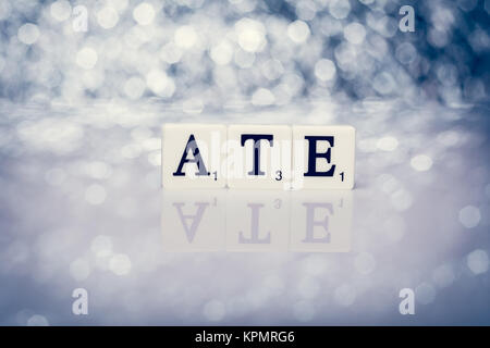 Written word of tiles with letters - ate Stock Photo - Alamy