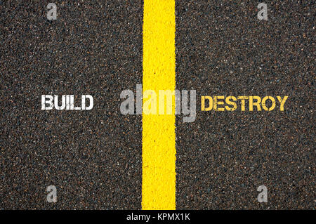 Antonym concept of BUILD versus DESTROY written over tarmac, road ...