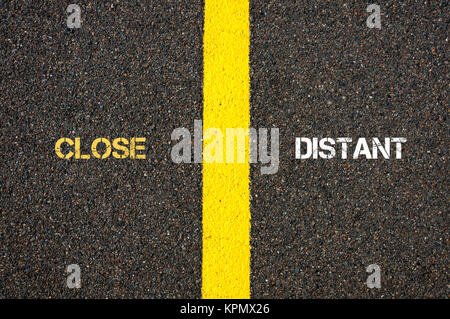Antonym concept of CLOSE versus DISTANT written over tarmac, road ...