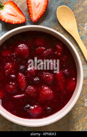 German Rote Gruetze (red groats) red berry pudding made of strawberry ...