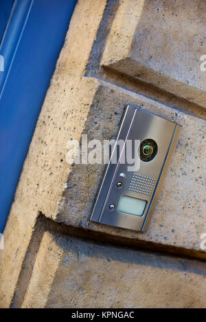 Intercom and camera on a stone wall Stock Photo - Alamy
