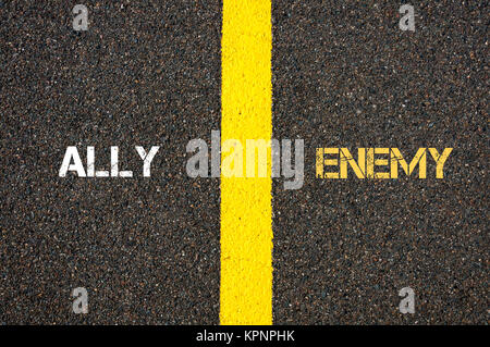 Antonym concept of ALLY versus ENEMY written over tarmac, road marking ...