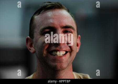 1st Lt. Michael Thrasher, 380th Expeditionary Security Forces, removes ...
