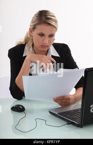 Businesswoman going through files Stock Photo - Alamy
