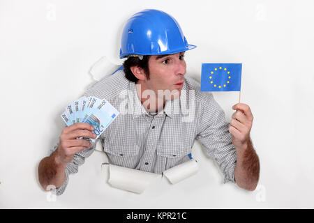Craftsman holding european flag Stock Photo - Alamy
