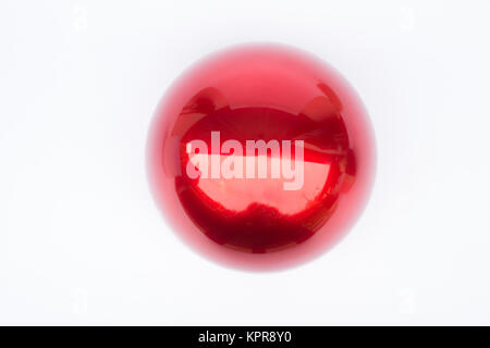 Shiny hard red ball on white background Stock Photo - Alamy