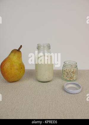 Muesli smoothie with pear Stock Photo - Alamy