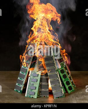 pile of random access memory sticks and some smoke in front of dark ...