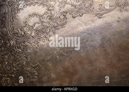 Tarnished silver scrollwork background Stock Photo - Alamy
