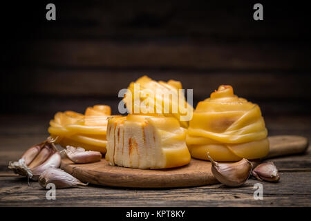 Handicraft twisted cheese Stock Photo - Alamy