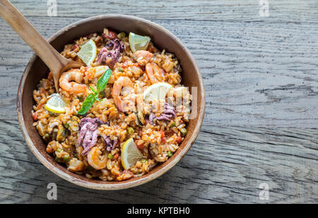 Delicious paella, cooked risotto rice with chicken thigh, king prawns ...