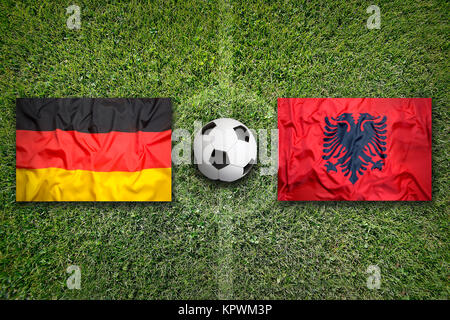 Germany vs. Albania flags on green soccer field Stock Photo - Alamy