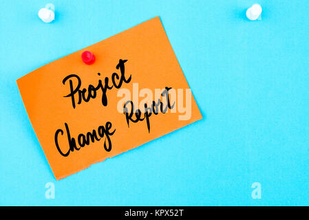 Project Change Report written on orange paper note pinned on cork board ...