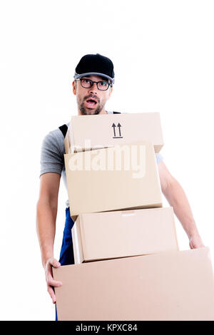 overstrained postman with parcels in front of white background Stock ...
