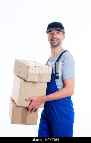 friendly postman with parcels in front of white background Stock Photo ...