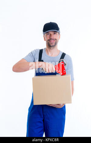 friendly postman with parcels in front of white background Stock Photo ...