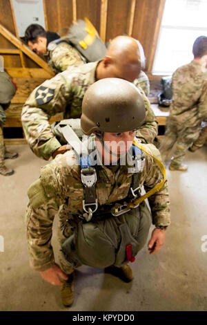 A U.S. Army paratrooper receives Jumpmaster Personal Inspection (JMPI ...