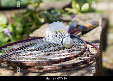 Old fashioned badminton racket and shuttlecock outdoor Stock Photo - Alamy