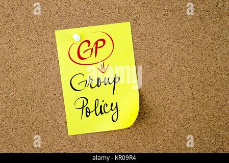 Business Acronym GP Group Policy written on yellow paper note pinned on ...