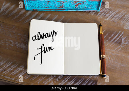 Text Always Fun handwritten on notebook Stock Photo - Alamy